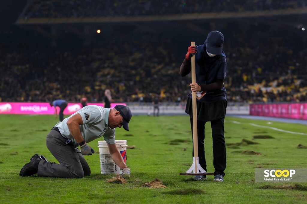 Bukit Jalil stadium pitch becomes a joke with patching crew working at ...