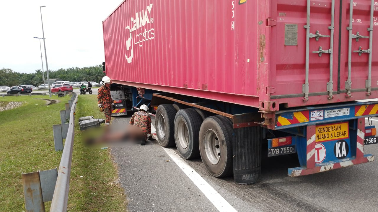 Woman dragged 80m after motorcycle collides with container lorry near ...